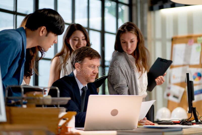 Professional Manger Point To Monitor of Laptop and Explain the Process ...
