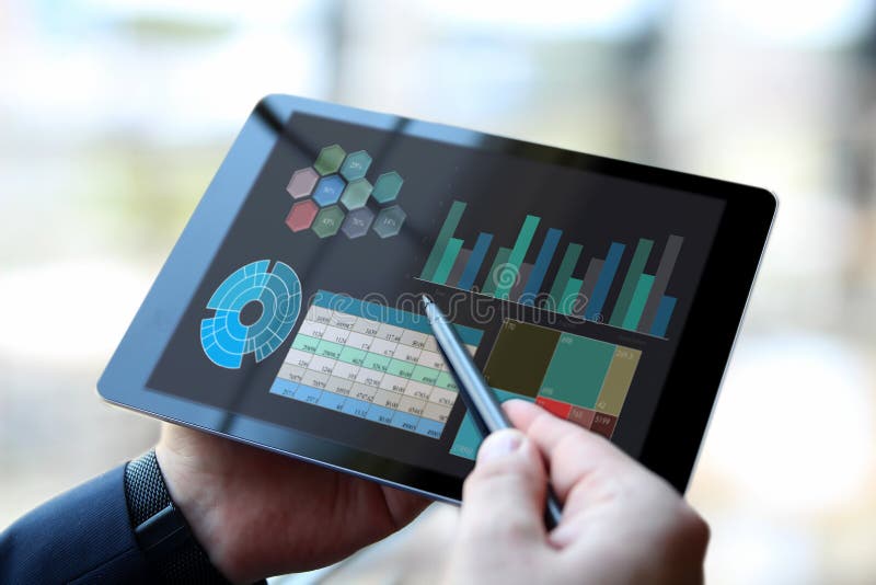 Business Man Working and Analyzing Financial Figures on a Graphs on a ...