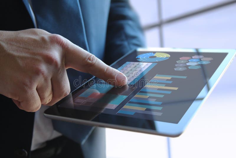 Business Man Working and Analyzing Financial Figures on a Graphs on a ...