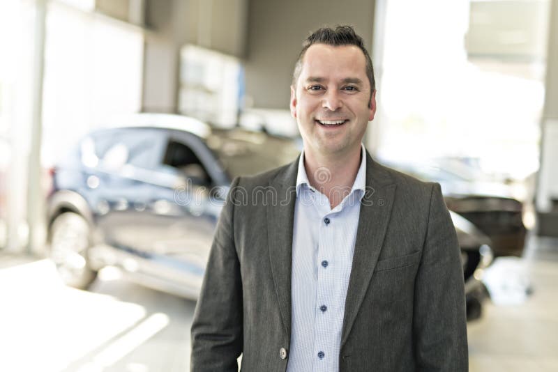 Business Man Working at a Car Dealer Smiling Stock Photo - Image of ...