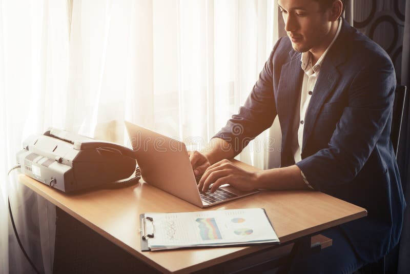 Business Man Working on Computer on the Desk by the Windows Stock Image ...