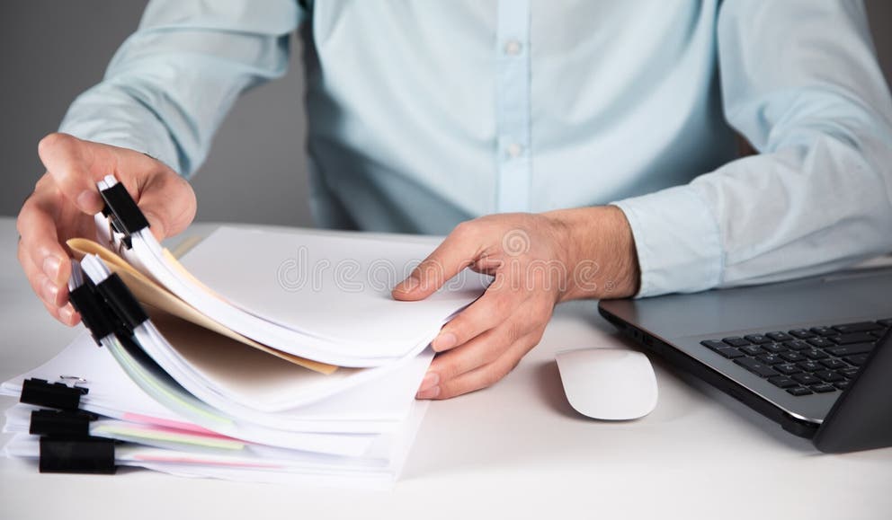 Man Working Computer and Stack of Documents Stock Photo - Image of ...