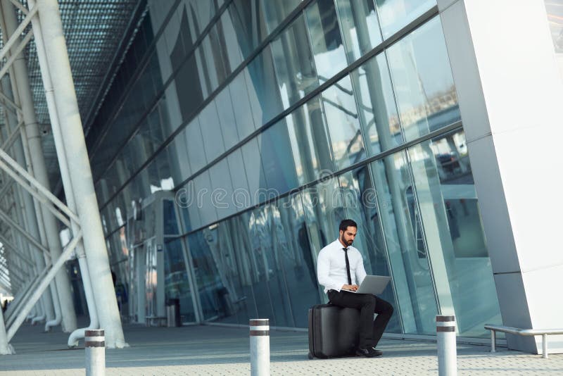 Business Man Working on Computer Traveling at Airport Stock Photo ...