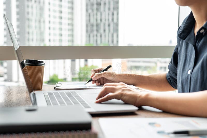 Business Man Working with Graph Data in Laptop and Documents on His ...
