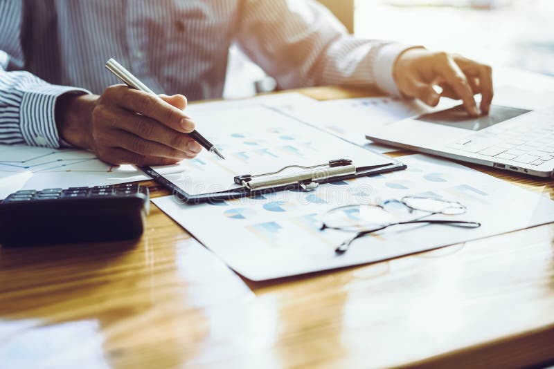 Business Man Working with Intention, Hand Holding Pen and Using Laptop ...