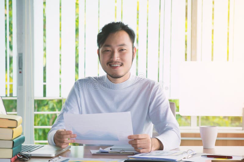 Business Man Working with Laptop Computer and Documents on His Desk at ...