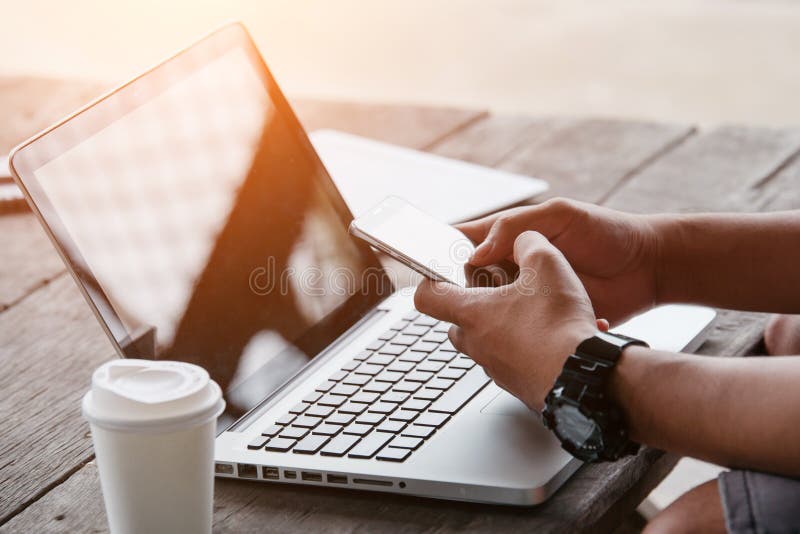 Man Using Internet on Smart Phone and Laptop Stock Photo - Image of ...