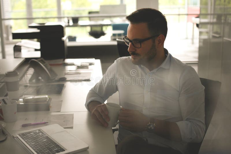 Business Man Working in Office. Business Man Watching Something Stock ...