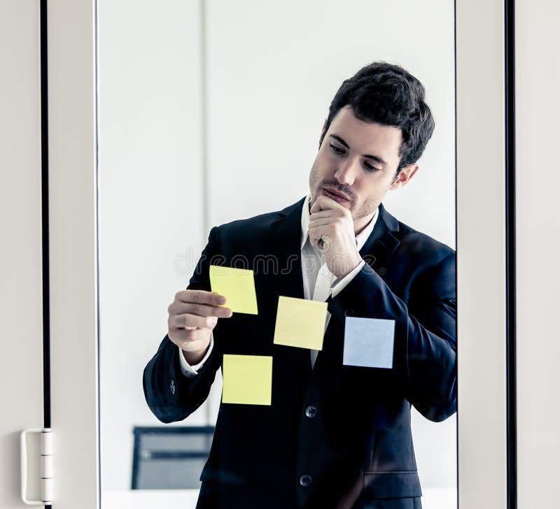 Business Man Writing Idea on To Post it Windows for Plan Stock Image ...