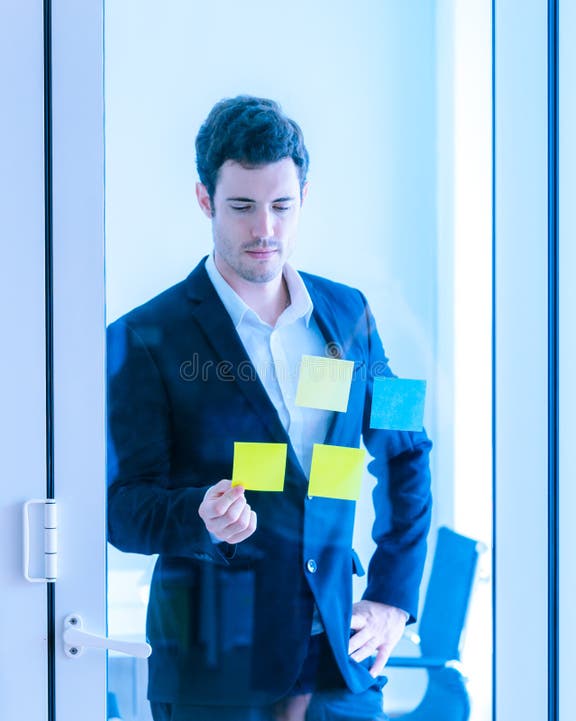 Business Man Writing Idea on To Post it Windows for Plan Stock Photo ...
