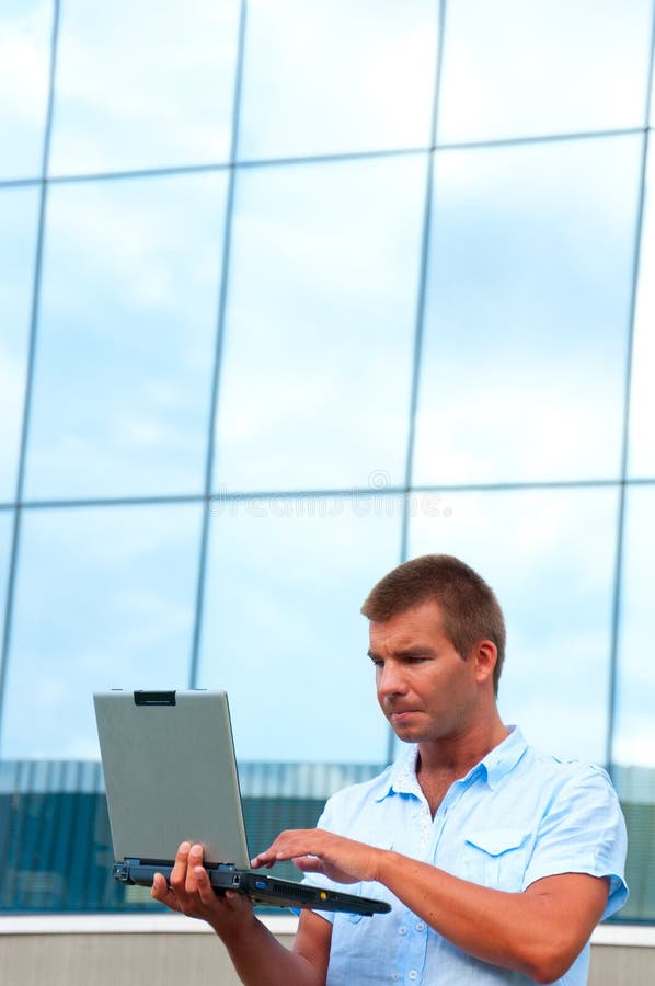 Business Manwith Laptop in Front of Modern Business Building Stock ...