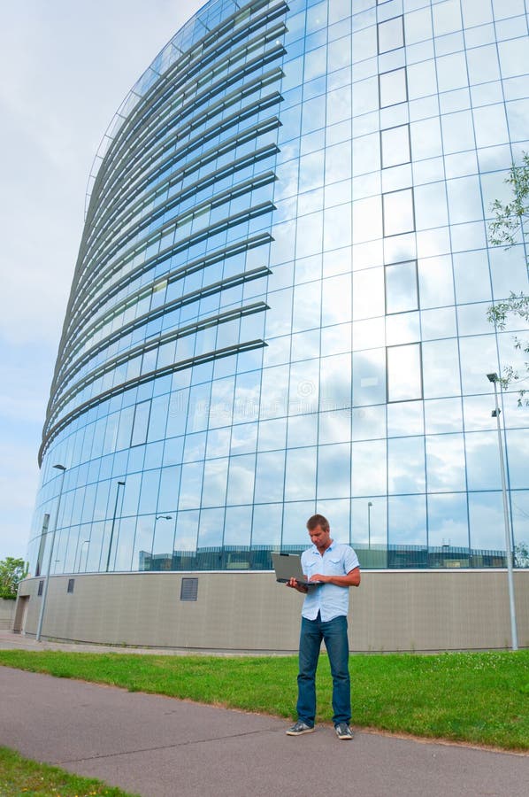 Business Manwith Laptop in Front of Modern Business Building Stock ...