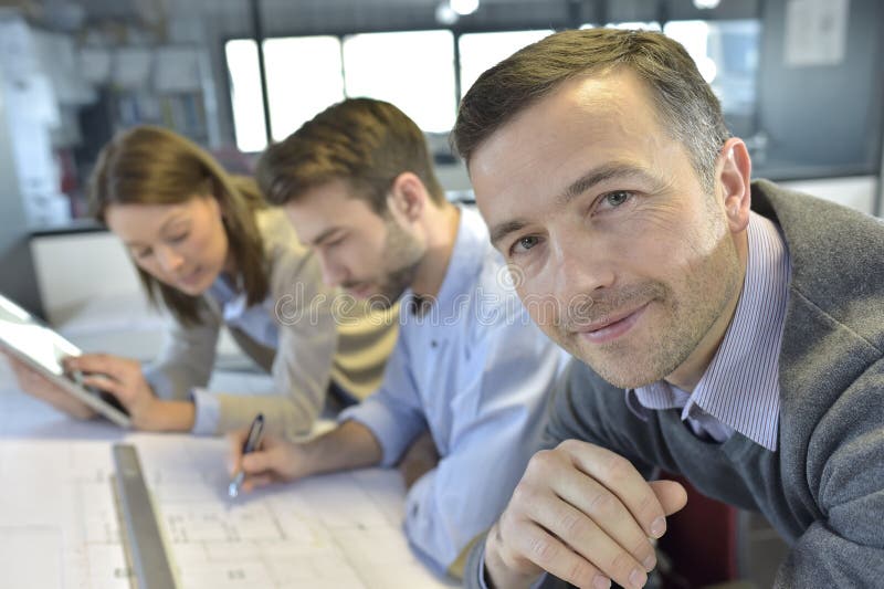 Business Meeting of Architects Stock Photo - Image of teamwork, indoors ...