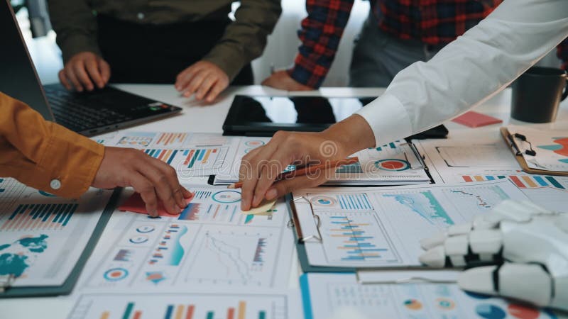 During a Business Meeting, a Consultant and an Assistant Use an ...