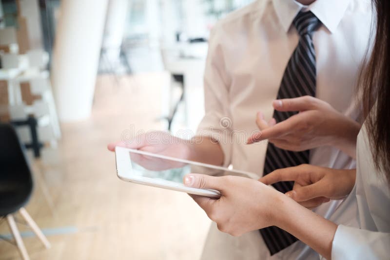 Business Meeting Image of Two Young Using Tablet. Stock Image - Image ...