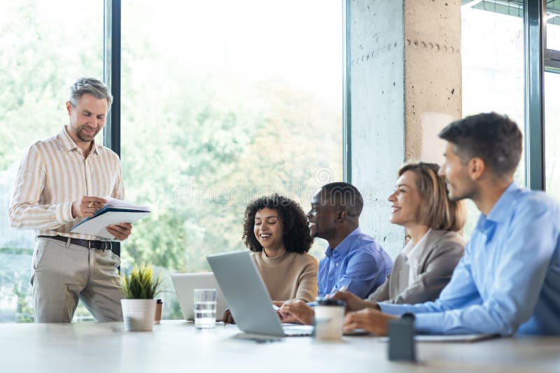 Business Meeting - Manager Discussing Work with His Colleagues. Stock ...