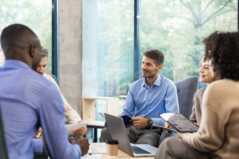 Business Meeting - Manager Discussing Work with His Colleagues. Stock ...