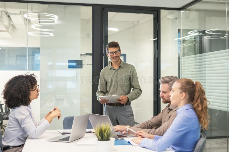 Business Meeting - Manager Discussing Work with His Colleagues. Stock ...