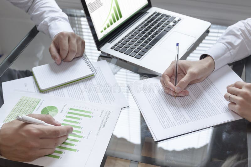 Business Meeting about Sustainable Development with Laptop and Notepad ...