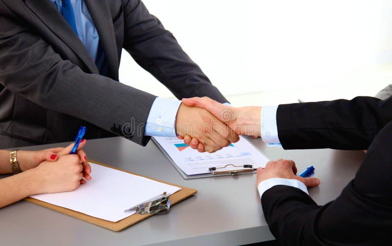 Business Meeting at the Table Shaking Hands Conclusion of the Contract ...