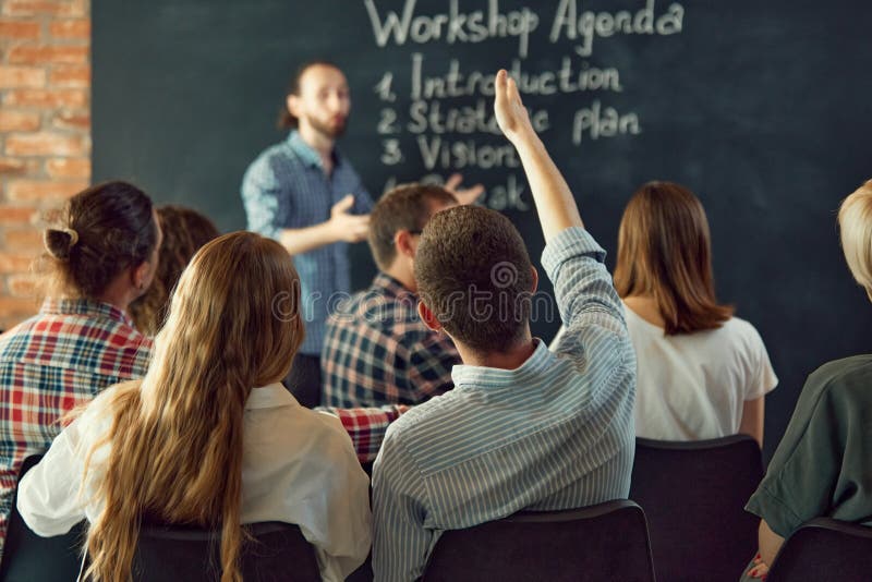 Business Man Raising Hand during Seminar. Hand Up in Conference Asking ...