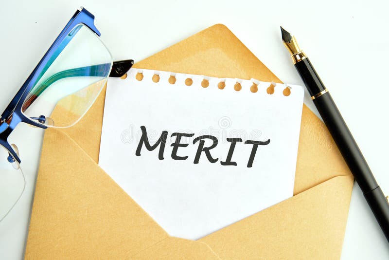 Business and Merit Concept. MERIT Written on a Sheet in an Envelope ...
