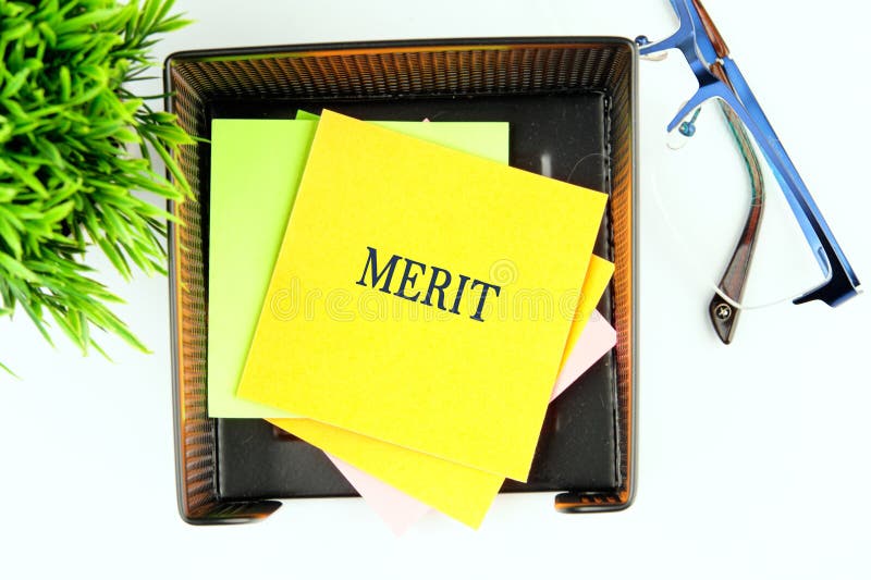 Business and Merit Concept. MERIT Written on a Yellow Sticker Stock ...