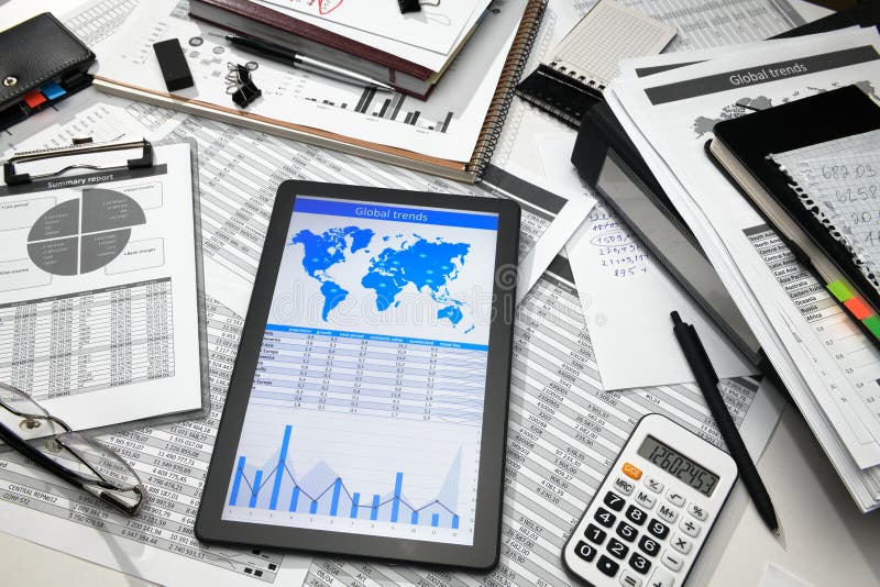 Business Office Desk Closeup - Tablet Computer with Tables and Graphs ...