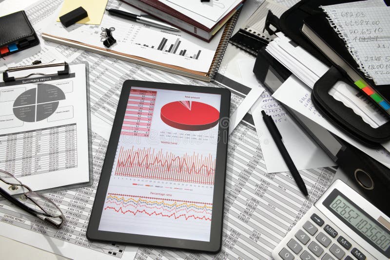 Business Office Desk Closeup - Tablet Computer with Tables and Graphs ...