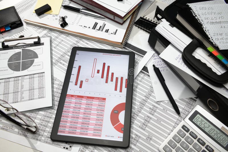Business Office Desk Closeup - Tablet Computer with Tables and Graphs ...