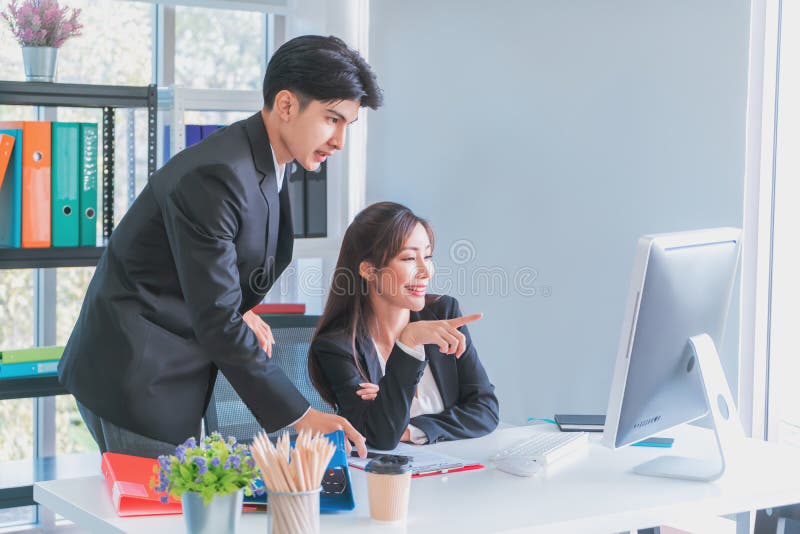 Business Office Workers in Office Team Discussing on the Computer ...
