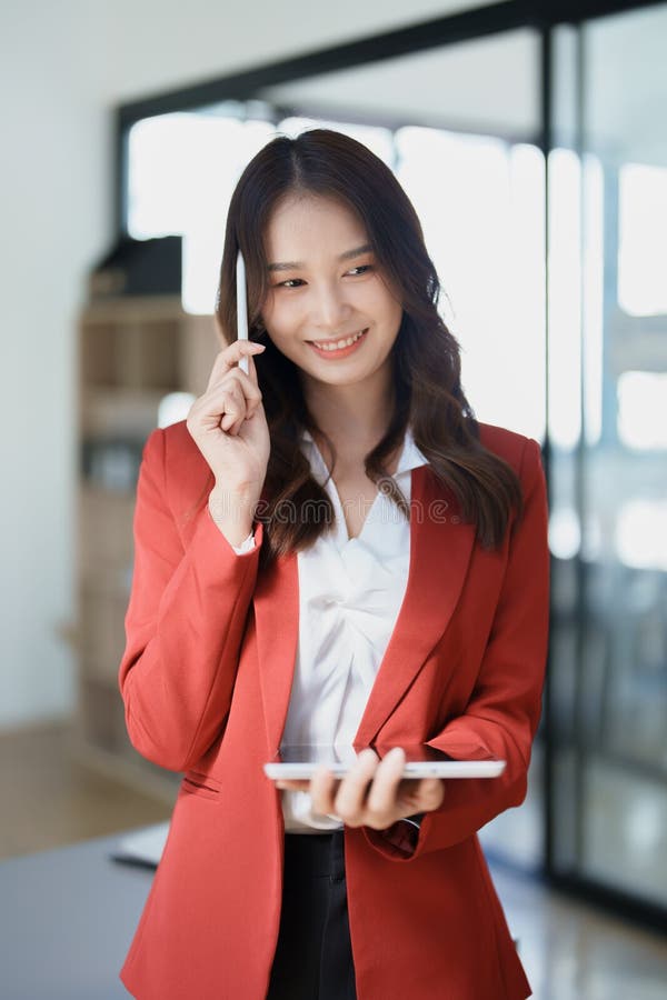 Business Owner or Asian Female Marketers are Using Tablet Computer in ...