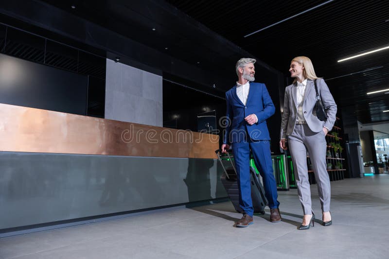 Business Owner Meeting a Partner in the Airport and Going To the Exit ...