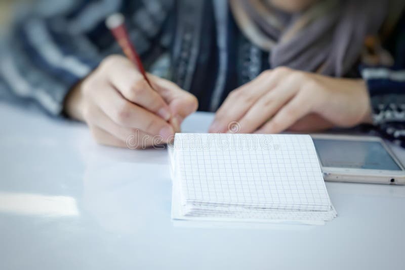 Business Owner Writing Down His Monthly Accounting with a Smartphone ...