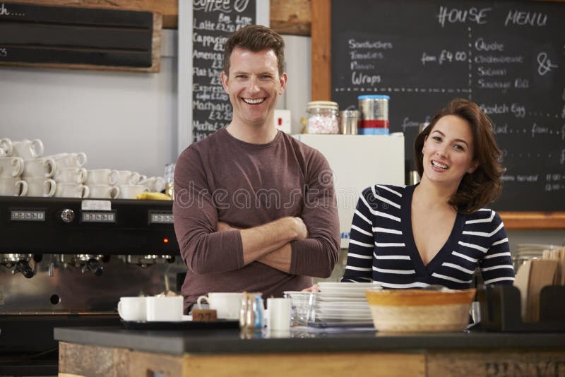 Business Owners Behind the Counter at Their Cafe, Close Up Stock Photo ...