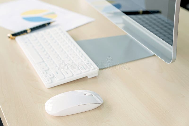 Business Papers with Graphs and Charts Placed on Desk with Computer and ...