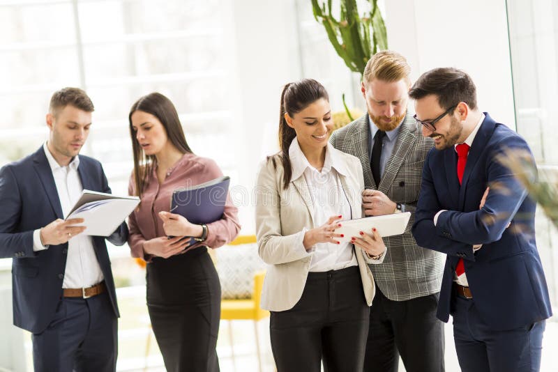 Business Partners Analyze the Business Results in Modern Office Stock ...