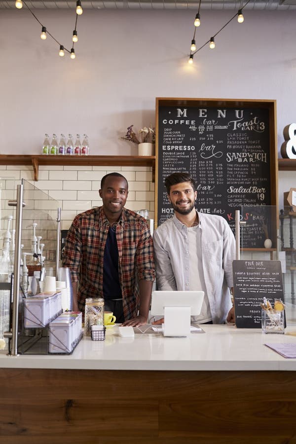 Business Partners at the Counter of a Coffee Shop, Vertical Stock Image ...
