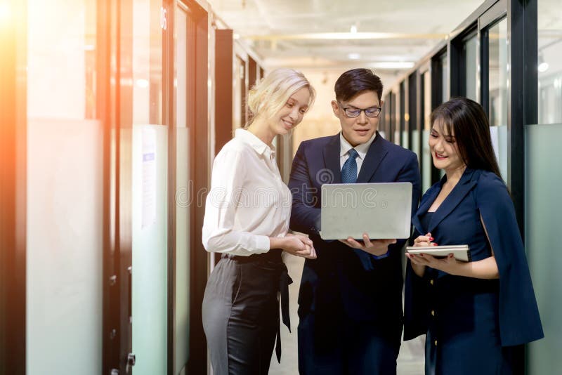 Business Partners Discussing Together Documents and Ideas at Office ...