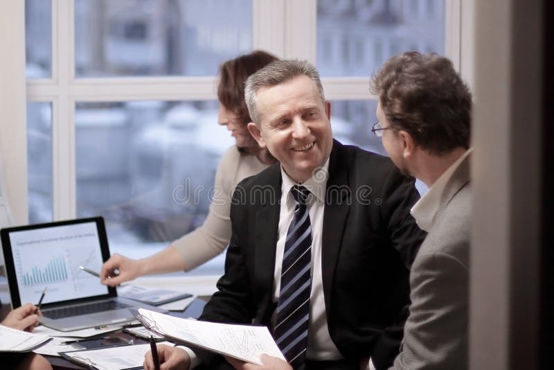 Business Partners Engaged in Dialogue in a Modern Office. Stock Photo ...