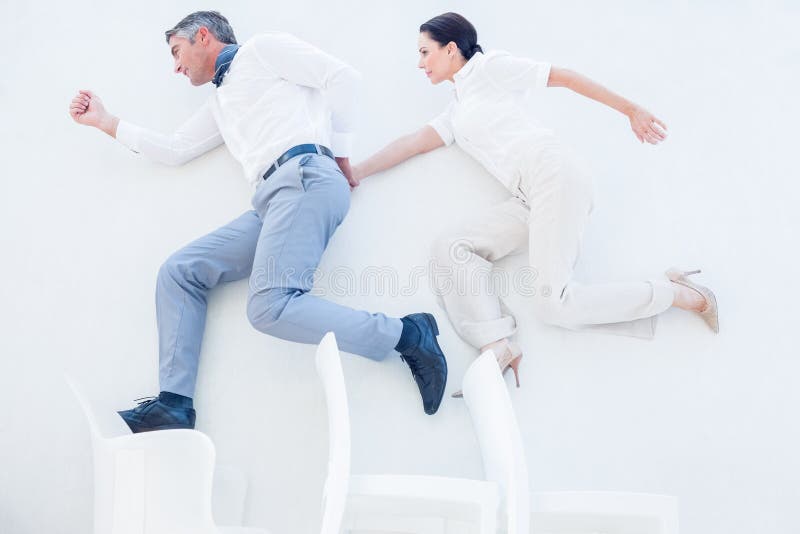 Business Partners Jumping Over Chairs Stock Image - Image of staff ...