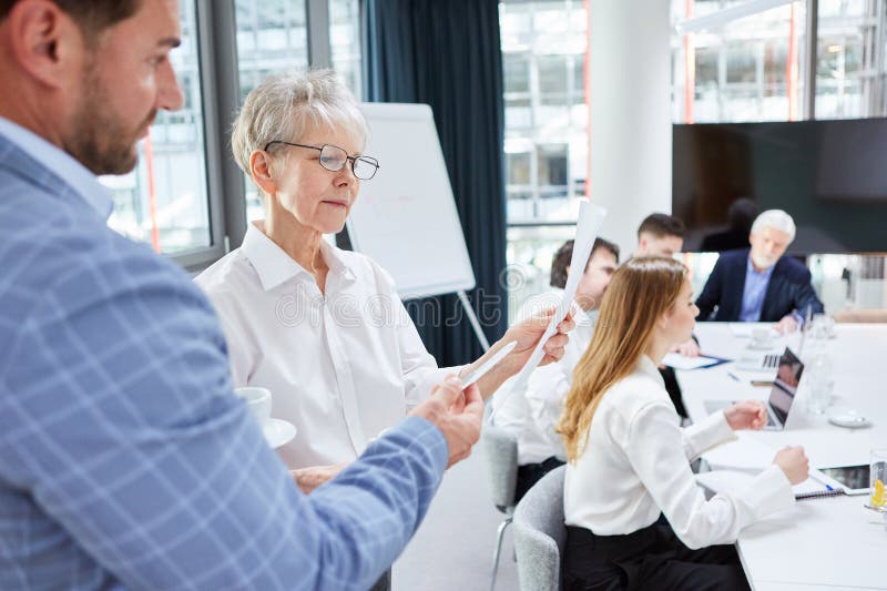 Business Partners Review a Contract Together Stock Image - Image of ...