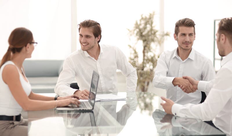 Business Partners Shake Hands at the Office Table. Stock Image - Image ...