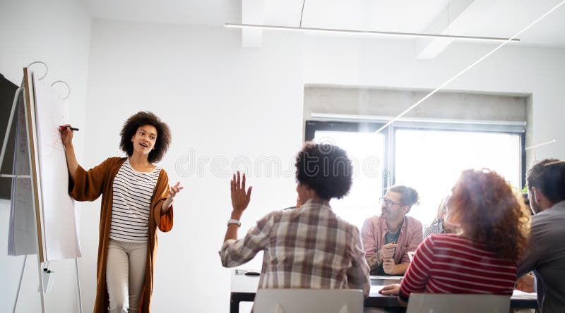 Business Partners Sharing Ideas and Planning Work at Meeting in Office ...