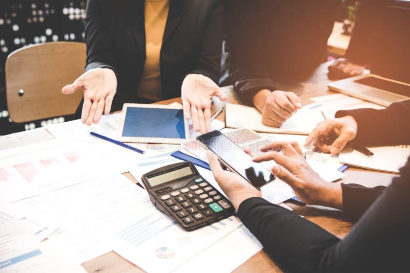 Business Partners and Teamwork Discussing Graph of Financial, Stock ...