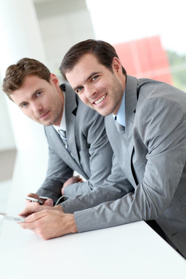 Business Partners Using Smartphones Stock Photo - Image of electronics ...