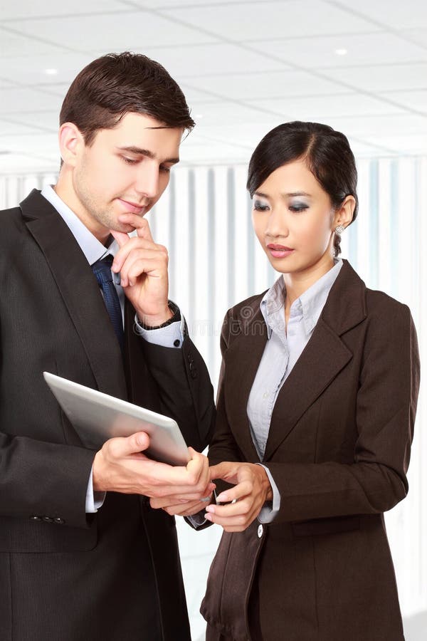 Business Partners Using Touchpad at Meeting Stock Image - Image of ...