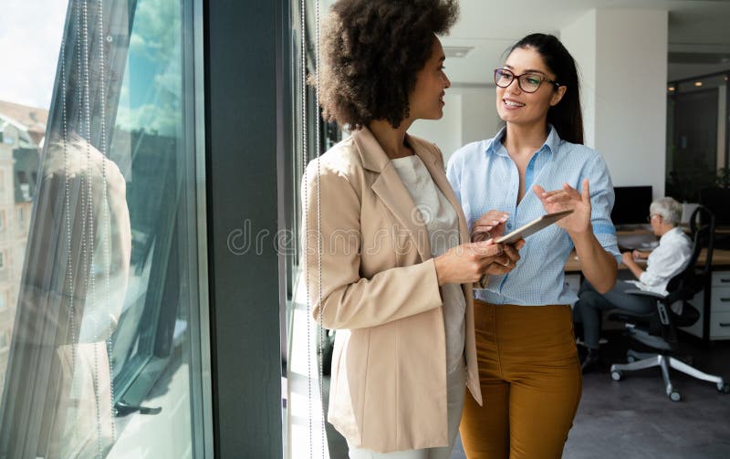 Business Partners Using Touchscreen Computer for Project Discussion ...