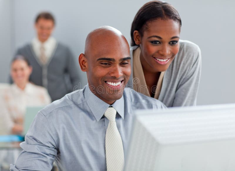 Business Partners Working at a Computer Together Stock Image - Image of ...
