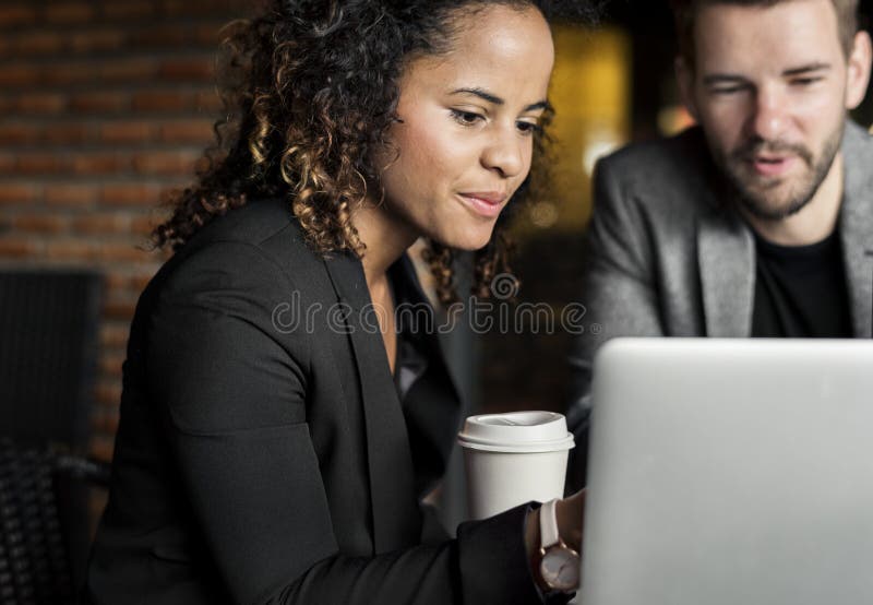 Business Partners Working Together at a Cafe Stock Image - Image of ...